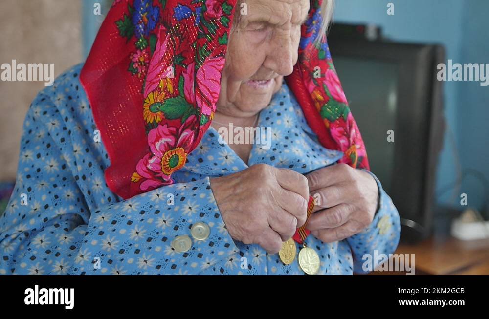 Old lady veteran with medals. Soviet union awards. Celebrating may of 9 ...
