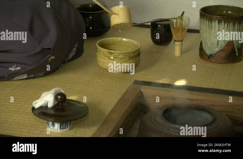 Hot water is ladled from tetsubin kettle during a Japanese tea ceremony ...