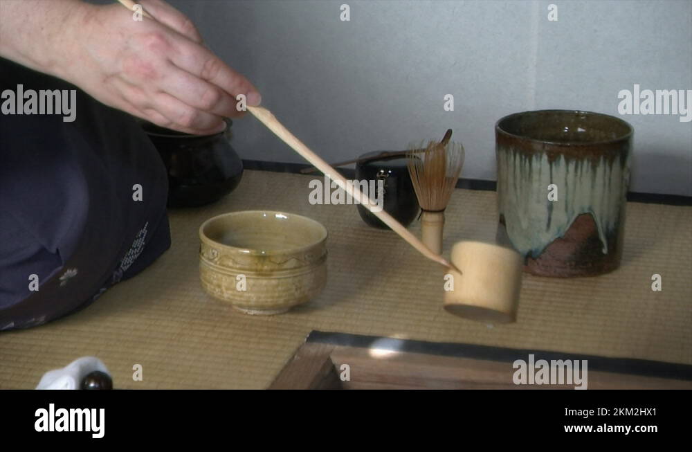 Hot water is added to tea bowl and whisked during a Japanese tea ...