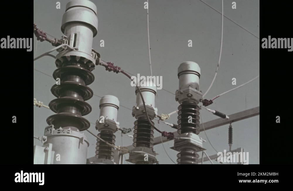 1960s: Shots of lines outside power station, transformer. Shots of ...