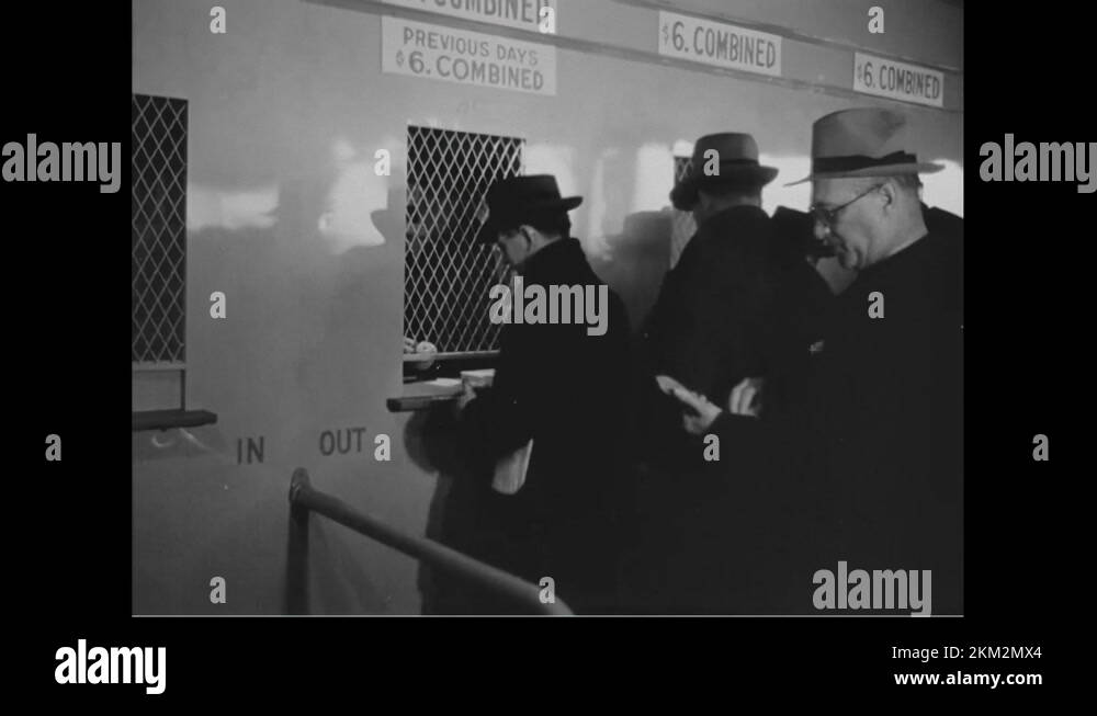 1940s: Horse racing odds screen. Horse racing betting windows. Woman in ...