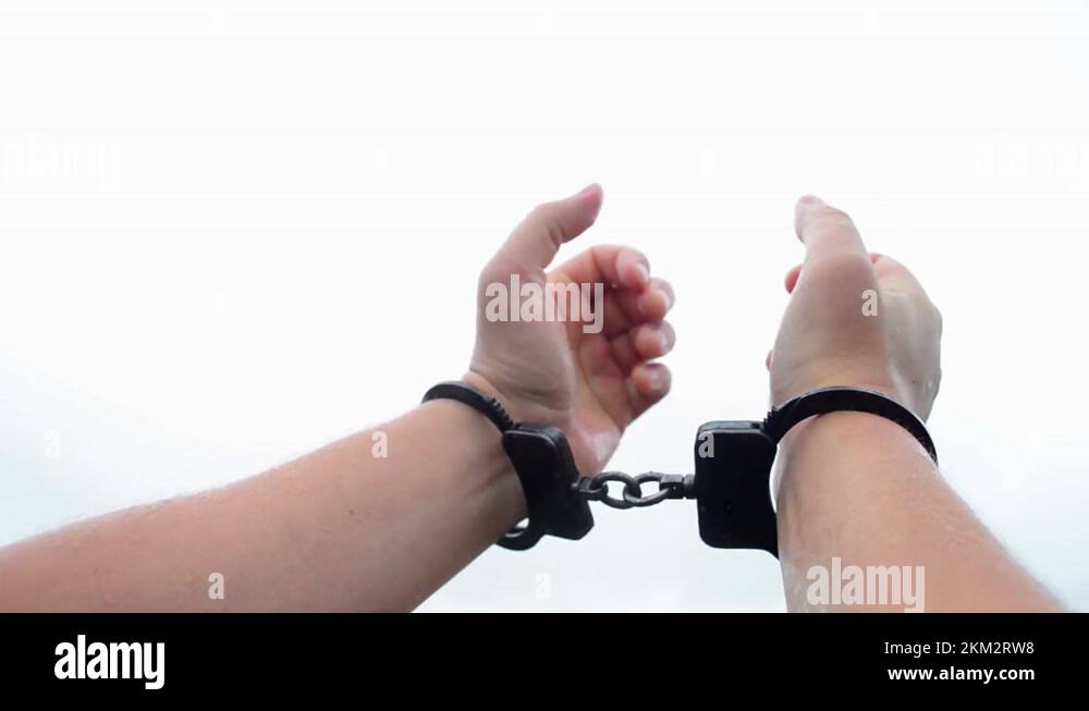 Hands in handcuffs Stock Videos & Footage - HD and 4K Video Clips - Alamy