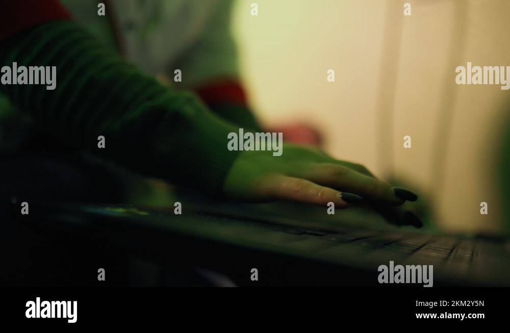Female fingers typing on laptop keyboard in green light Stock Video ...