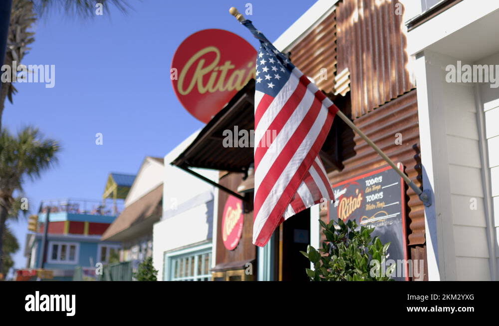 American flag hanging outside a restaurant with corrugated metal walls ...