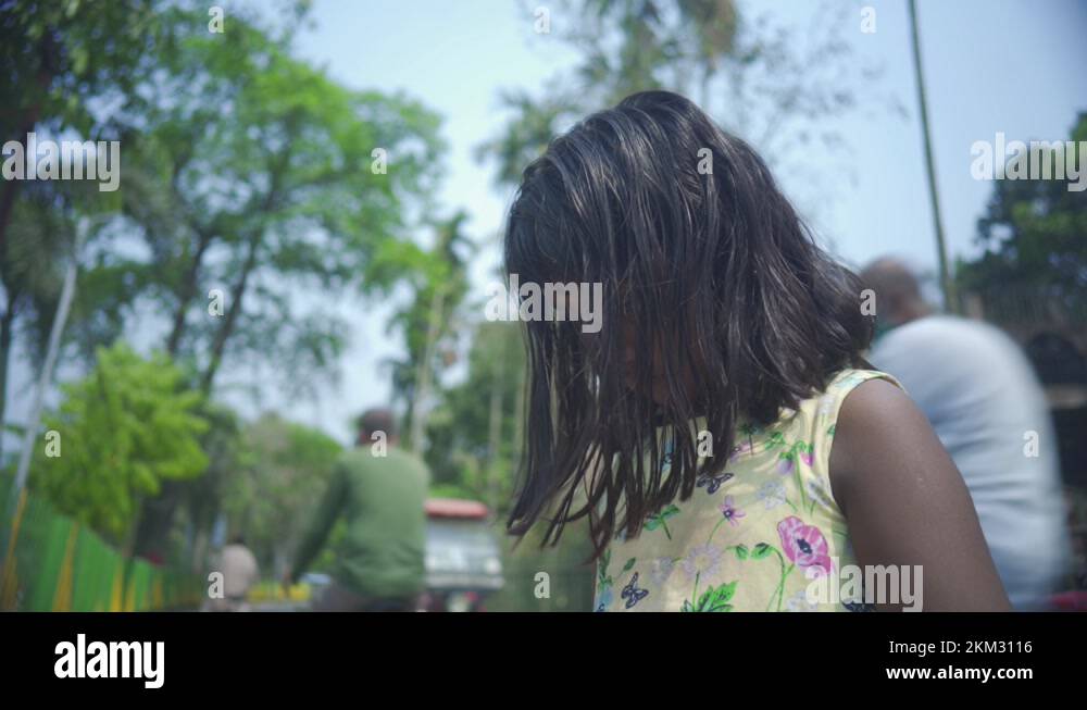 Sad Indian Poor Orphan Girl Looks Down On Road Suddenly Looks Behind