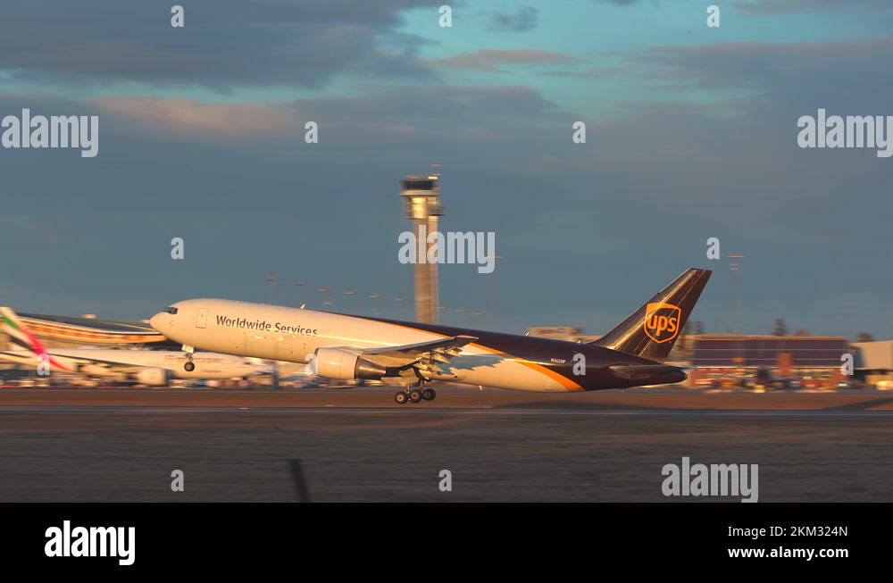 airplane ups cargo boeing 767 taking off panning left steep climb side ...