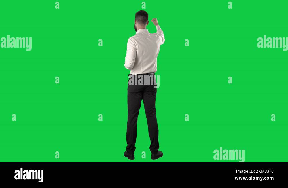 Back view of business man cheering and rooting clapping on green screen ...