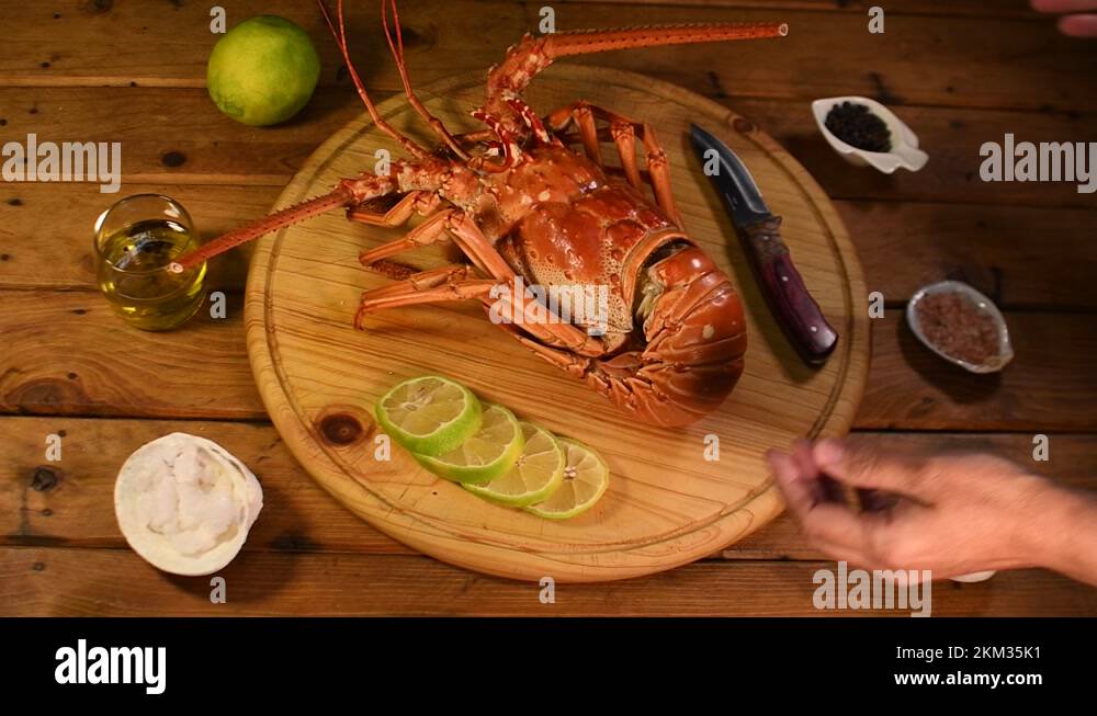 tow hand take off lobster cooking in table wood The lobster is getting ...