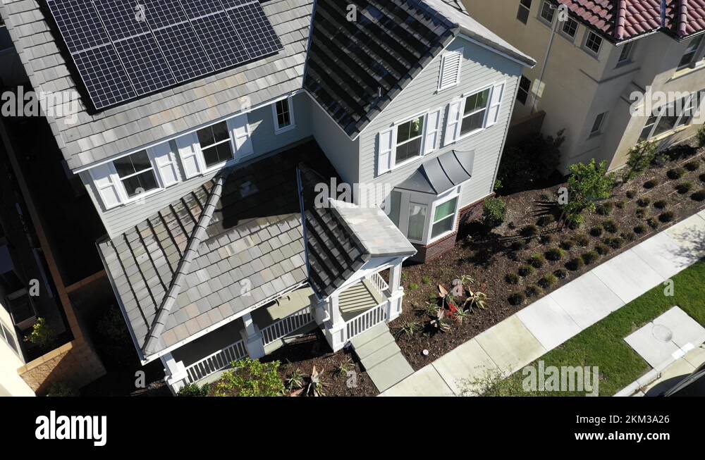 Descending aerial on Tustin house, solar on roof, green energy Stock ...