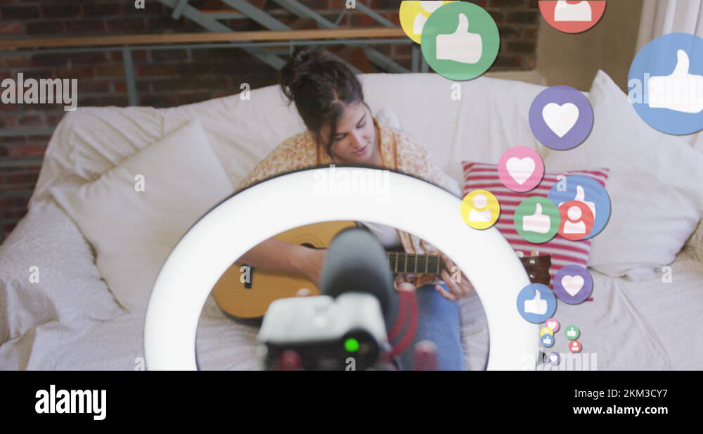 Animation of people, love and like icons over female vlogger with ...