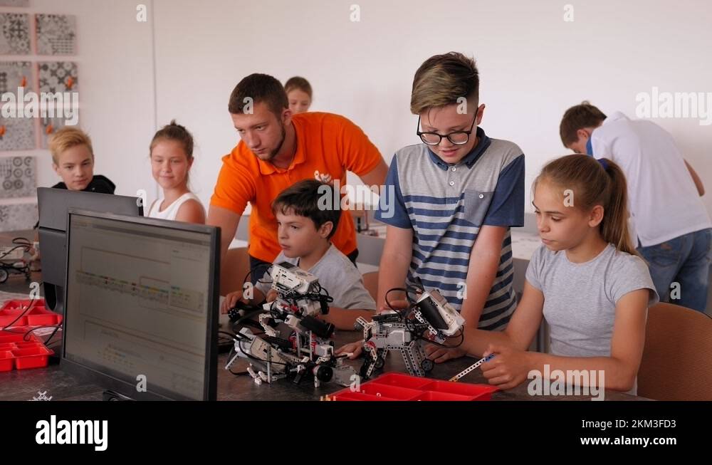 Kids building robot constructor from the plastics details at robotics ...