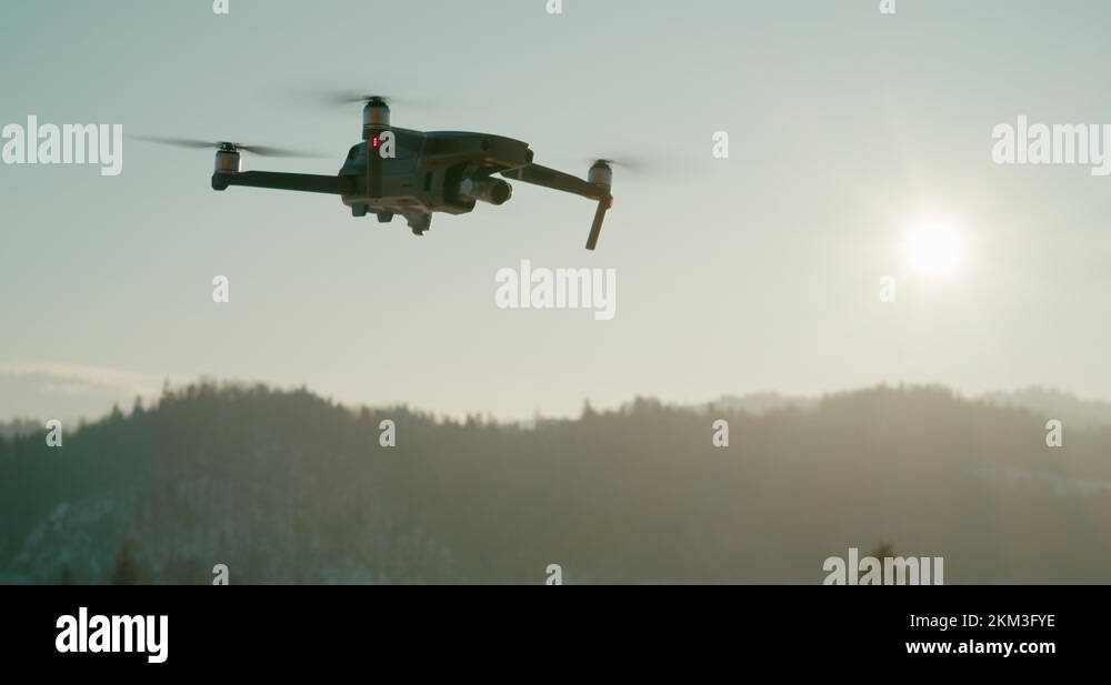 Flying UAV Drone Moves in Different Directions and Spinning in Sky ...