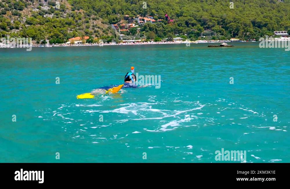 Man snorkeling with mask and flippers in the Oludeniz sea, Blue Lagoon ...