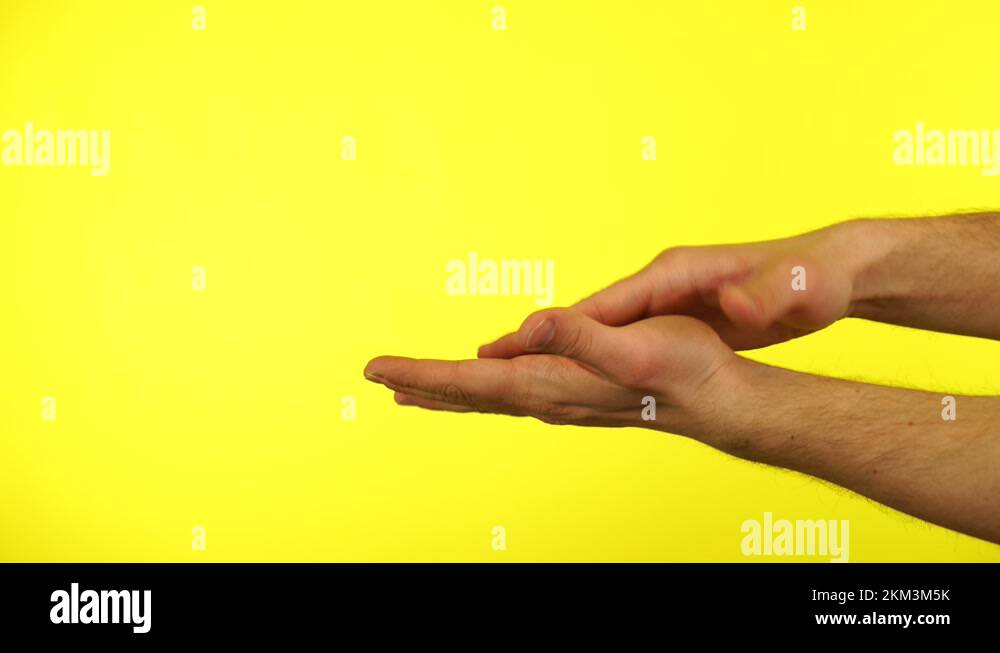 Hands clapping and showing on yellow background Stock Video Footage - Alamy