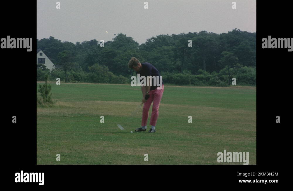 1960s: John F. Kennedy plays golf. John F. Kennedy and man putt golf ...