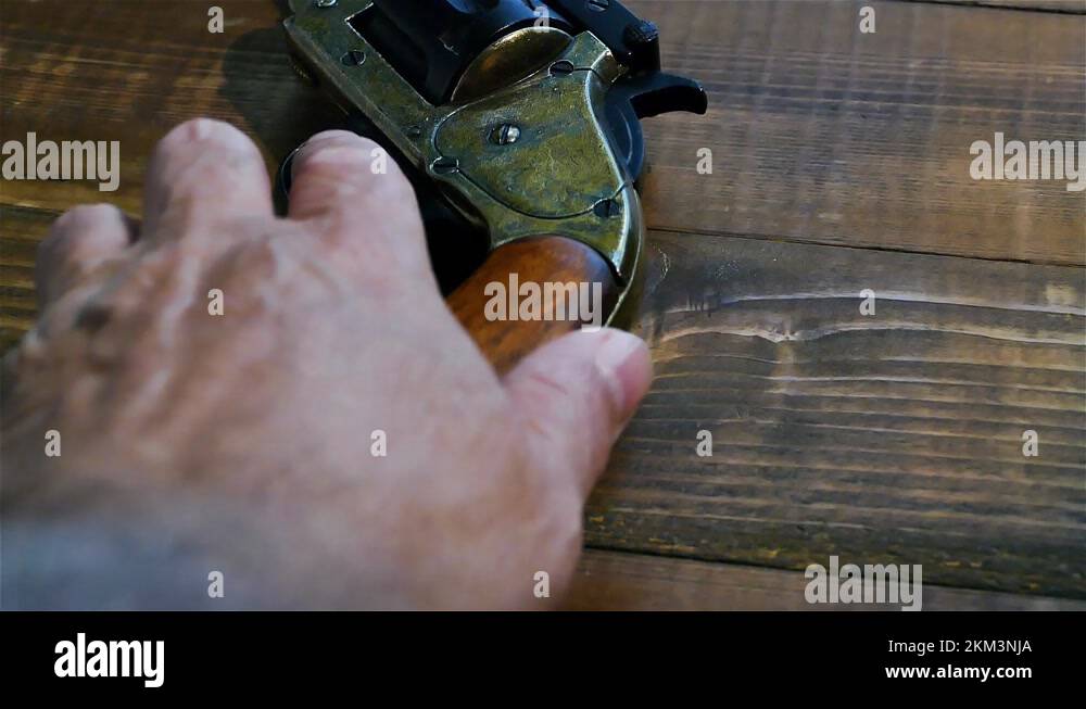 Hand gun table Stock Videos & Footage - HD and 4K Video Clips - Alamy