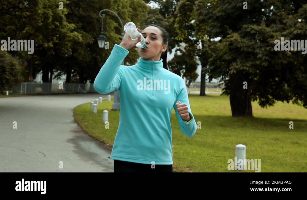 Female jogger drinking from water Stock Videos & Footage - HD and 4K ...