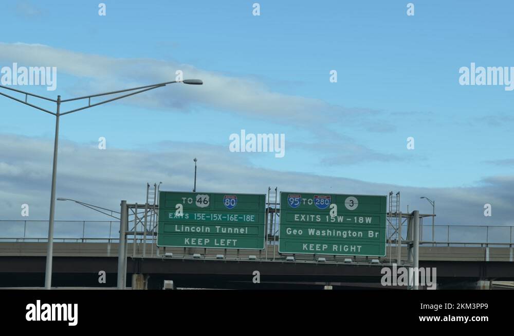 Driving under overpass Lincoln tunnel sign Stock Video Footage - Alamy
