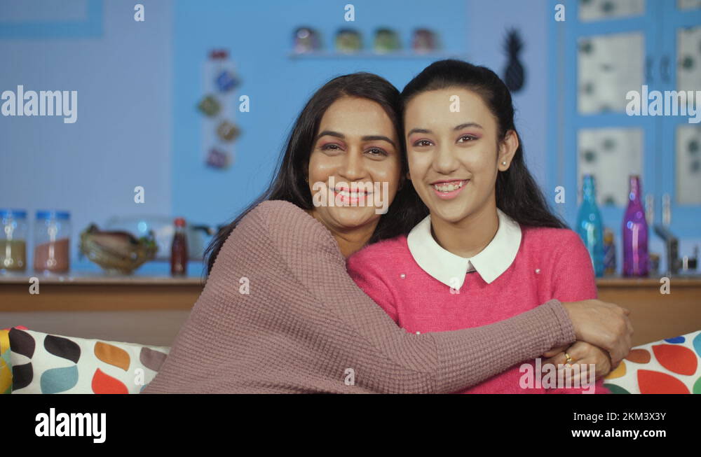 Caring and affectionate mother hugging her teenage daughter - family bonding Stock Video Footage ...