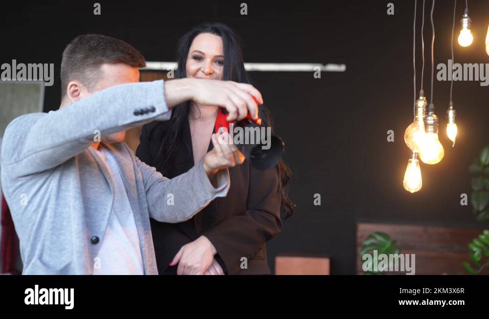 The photographer shows the female model the finished shots on the ...