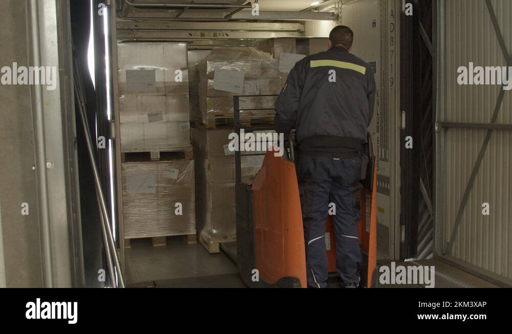 Loader loading cargo pallet in packed truck trailer Stock Video Footage ...