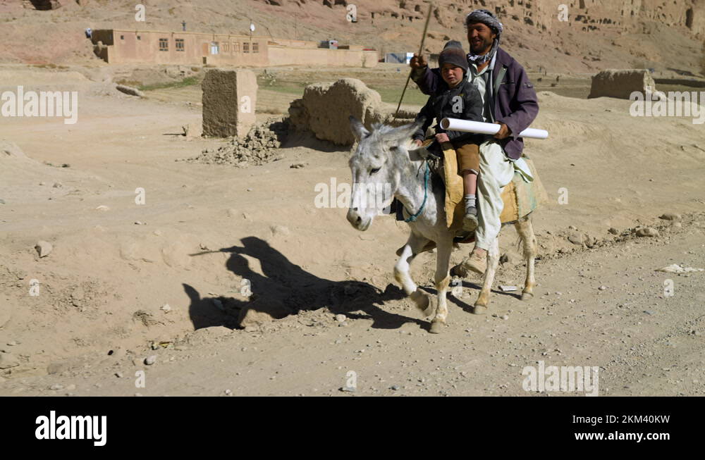 Afghani Local Riding A Donkey With His Son In Bamyan, Afghanistan Stock ...