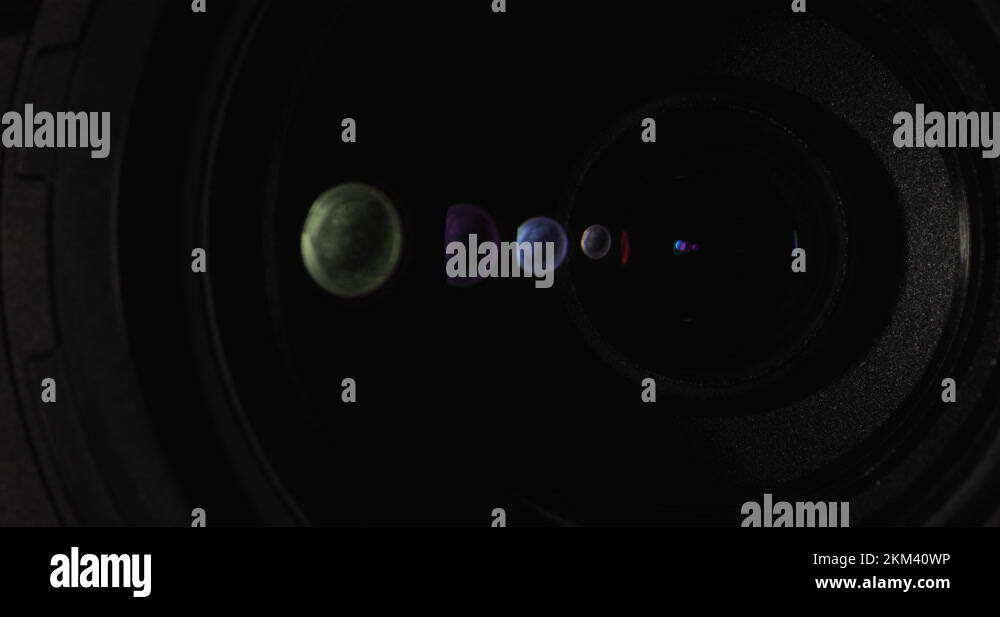 The front lens of the lens is illuminated by a beam of light with glare ...