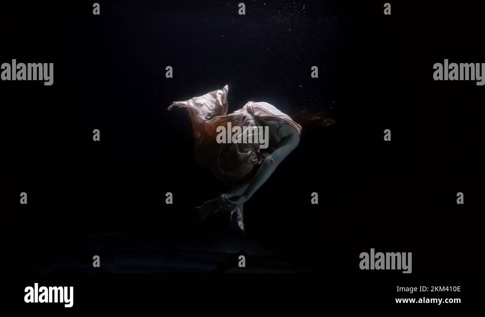 breathless woman is floating underwater, female corpse is drowning in ...