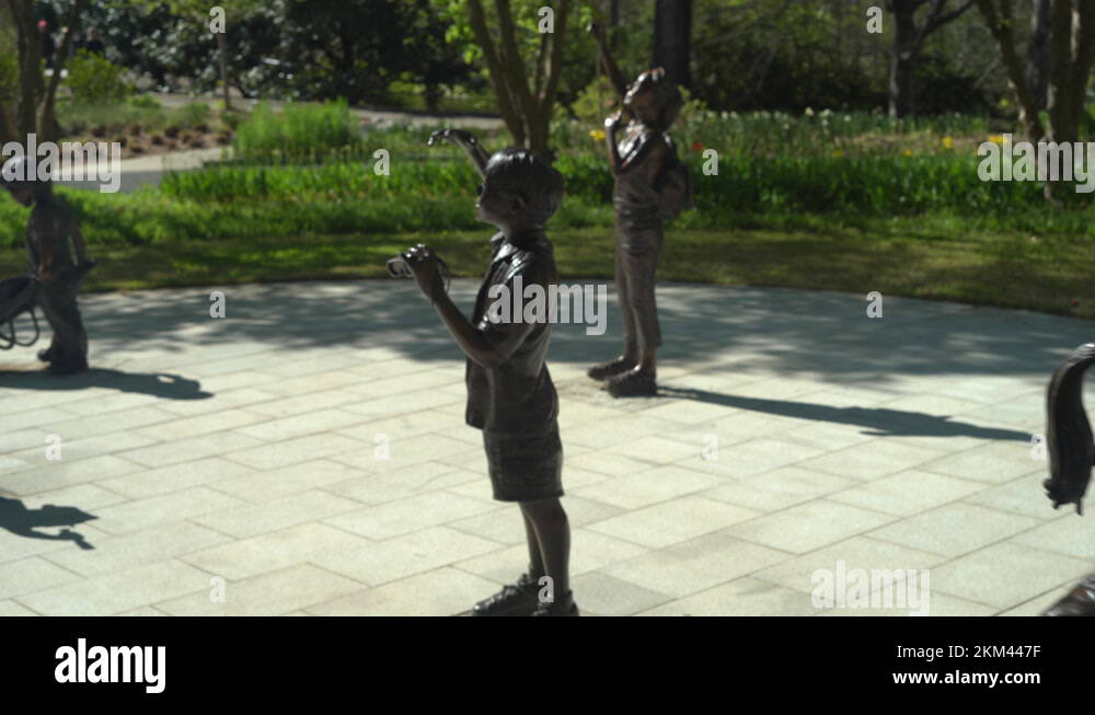 Statues of happy children looking in wonderment at the sky Stock Video ...