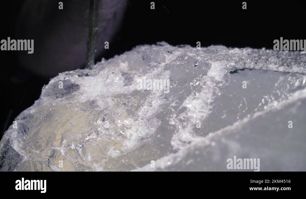 Creation of an ice sculpture in the studio with a chisel and hammer, 4k ...