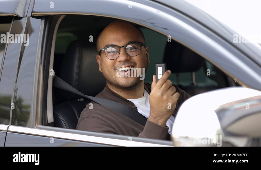 Young asian men around 30 getting new car. He very happy and excited ...