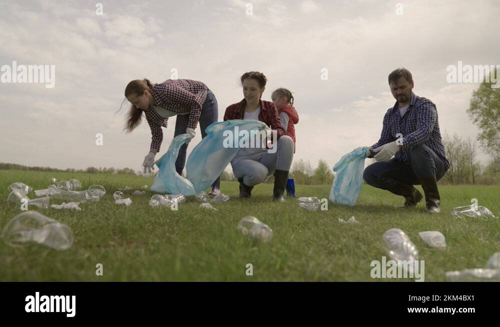 kid collecting trash volunteer teamwork. child group happy family on ...