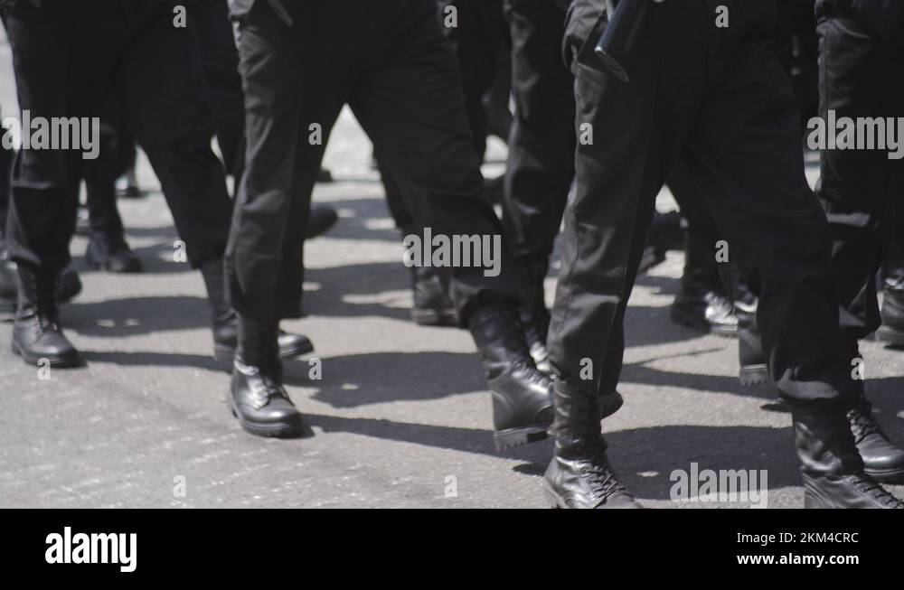 Soldiers marching in a parade through the town, Military Marching of ...