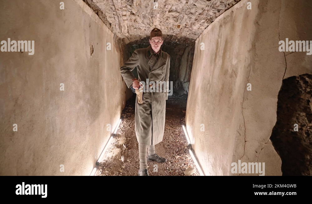 Austro-Hungarian officer in underground tunnel point the gun towards ...