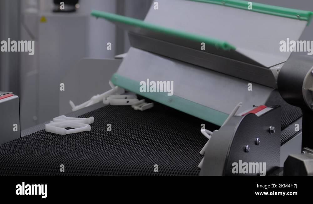 Automatic sorting conveyor system - moving plastic details on conveyor ...