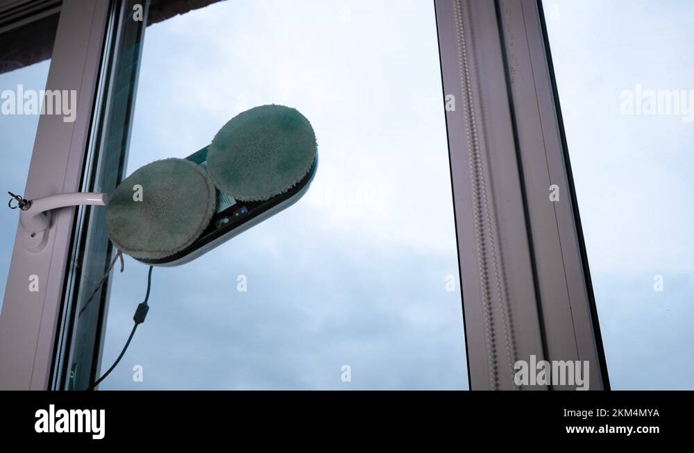 Automatic robot window cleaner. The robot vacuum cleaner cleans the ...