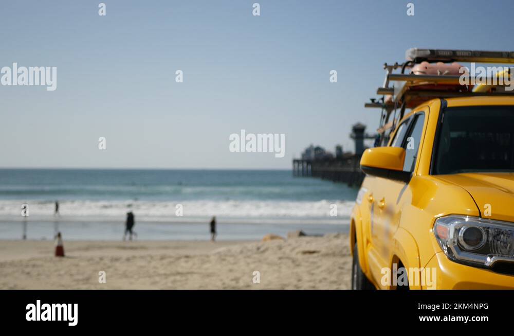 Yellow lifeguard car, ocean beach California USA. Rescue pick up truck ...
