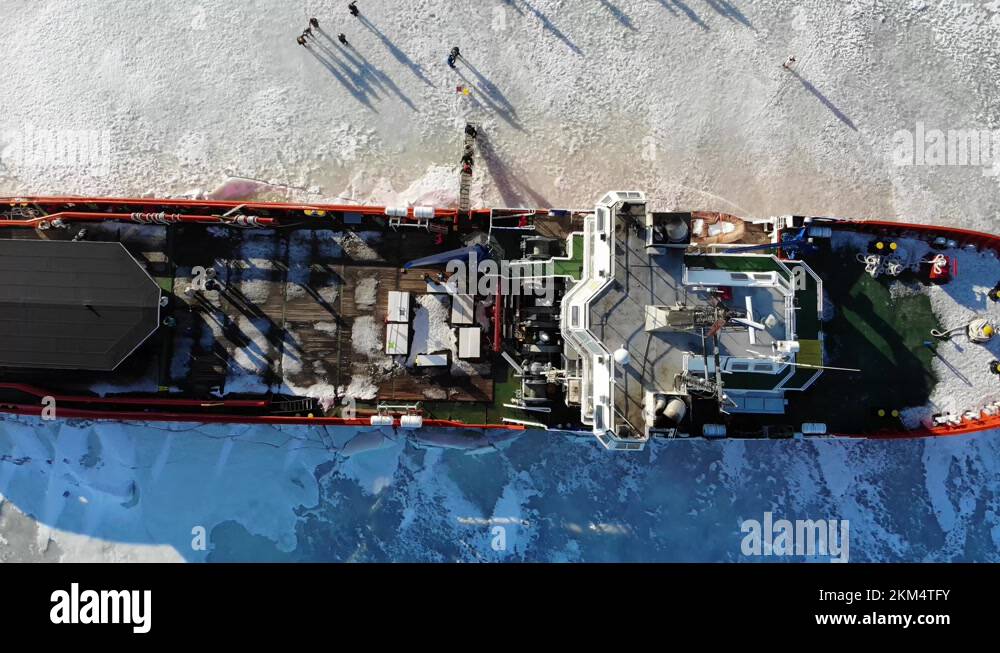 Ice breaker Ship - Ice breaker workers relaxing and swimming on frozen ...