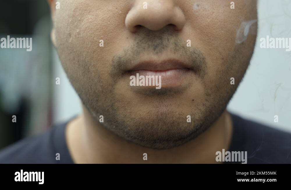 Young men smoking He smoked and spat out a lot of smoke. It is ...