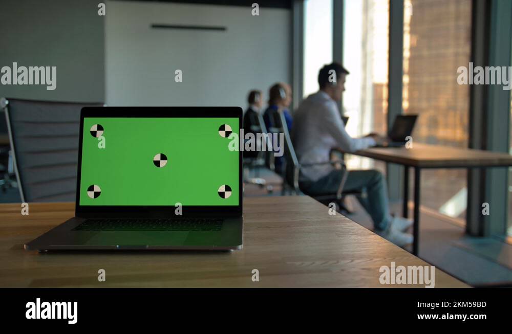 Ready for tracking green screen laptop with call centre employees at ...