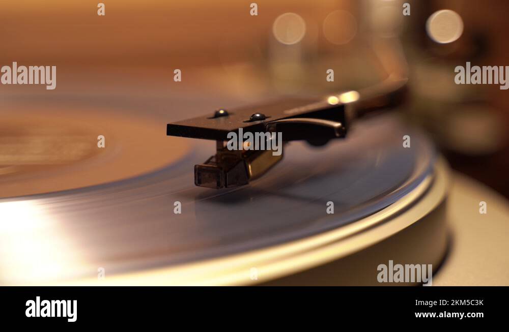 close-up of a turntable head that rides on a blue vinyl plank Stock ...