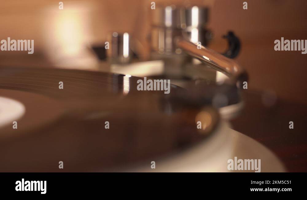 black vinyl record turntable head is out of focus and focus slowly ...
