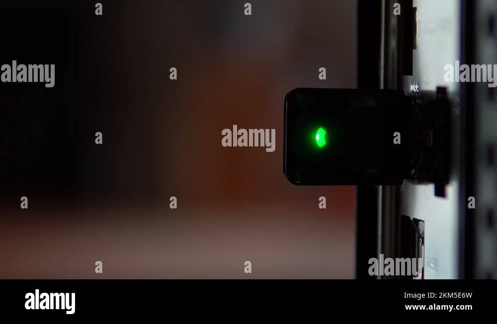 Usb modem wifi inserted into the computer close-up. The modem flashes a ...