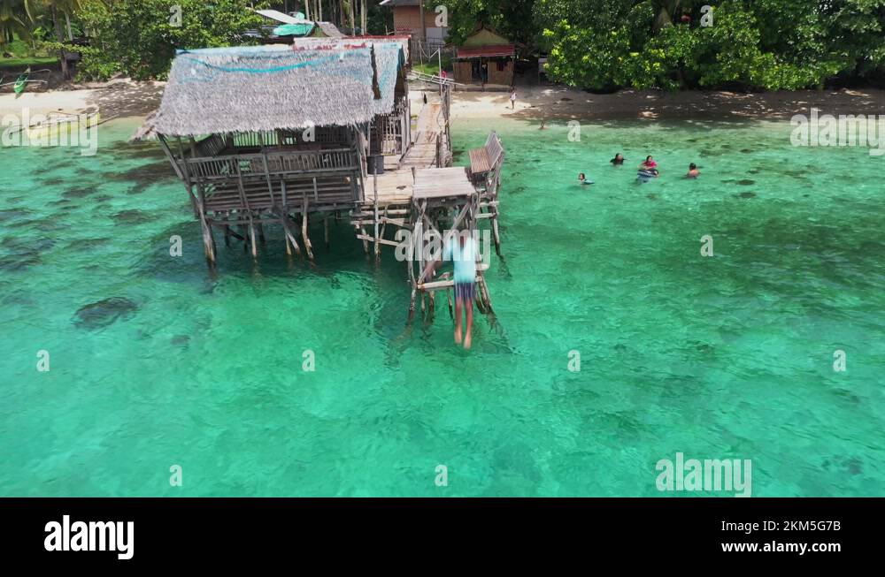 A Local Child Jump Into Boardwalk At San Pablo Island, Southern Leyte ...