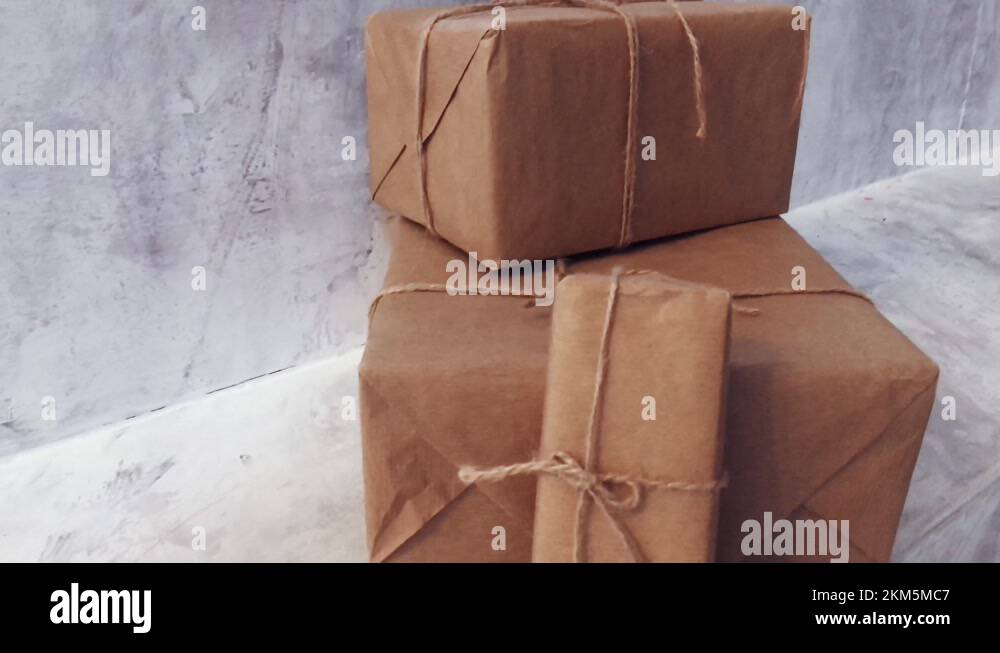 Packaged boxes for postal delivery service, parcels wrapped in brown ...