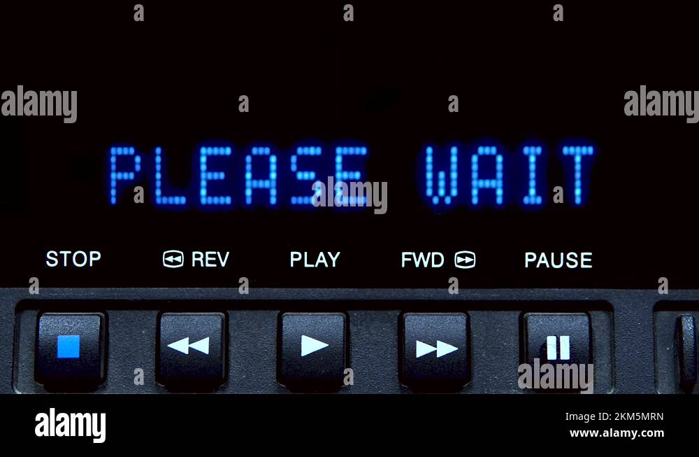 Disc player with screen. The word "please wait" is written on the ...