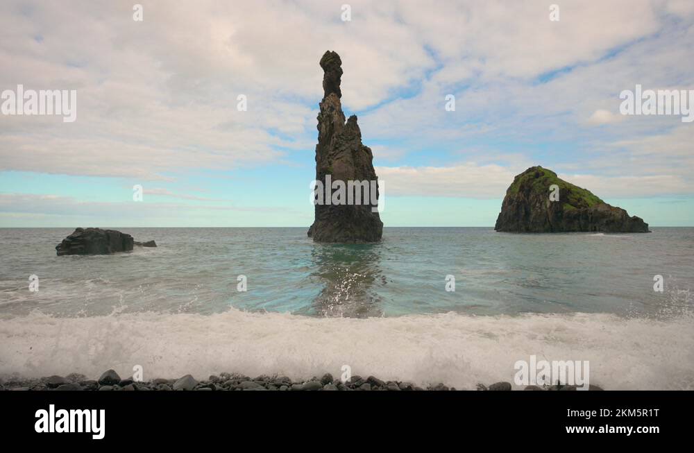 Waves at the Ribeira da Janela volcanic sea stacks in Madeira island ...