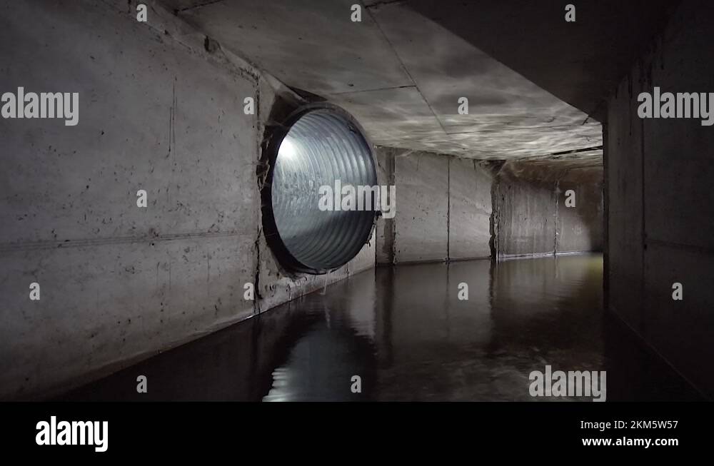 Concrete sewer or drainage collector filled with water, in which a ...