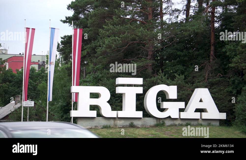 Cropped View Of Cars On The Street In Riga, Latvia With Huge Riga Sign ...