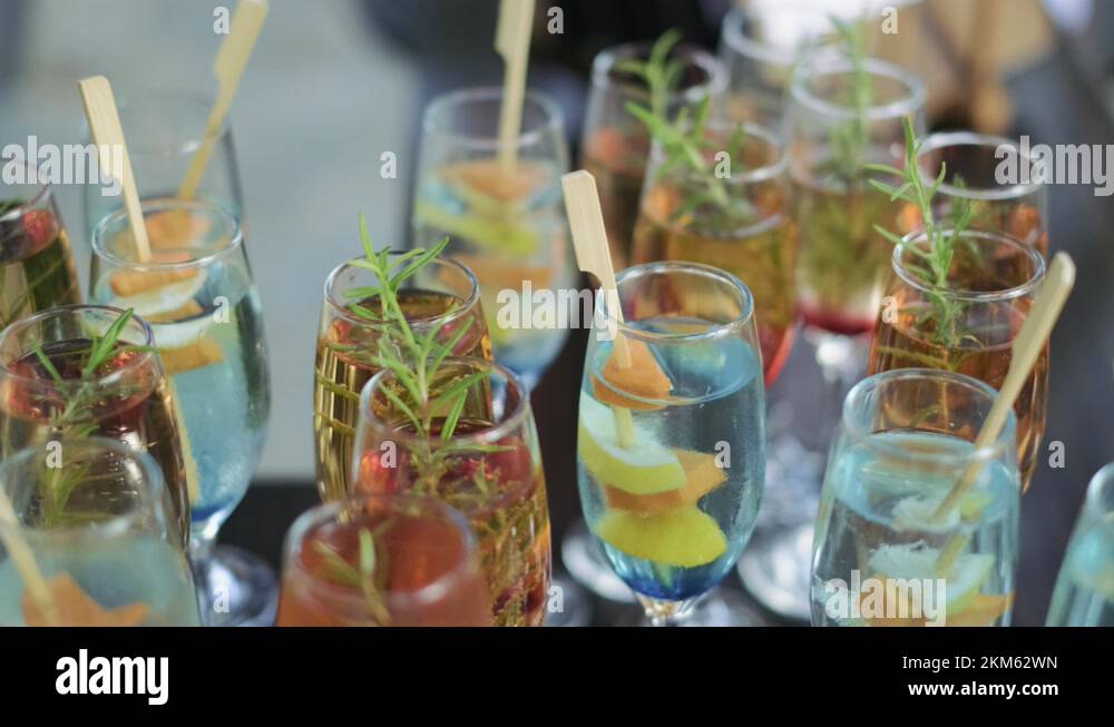 Full cocktail glasses on the buffet table. assorted cocktails. 4K Stock ...
